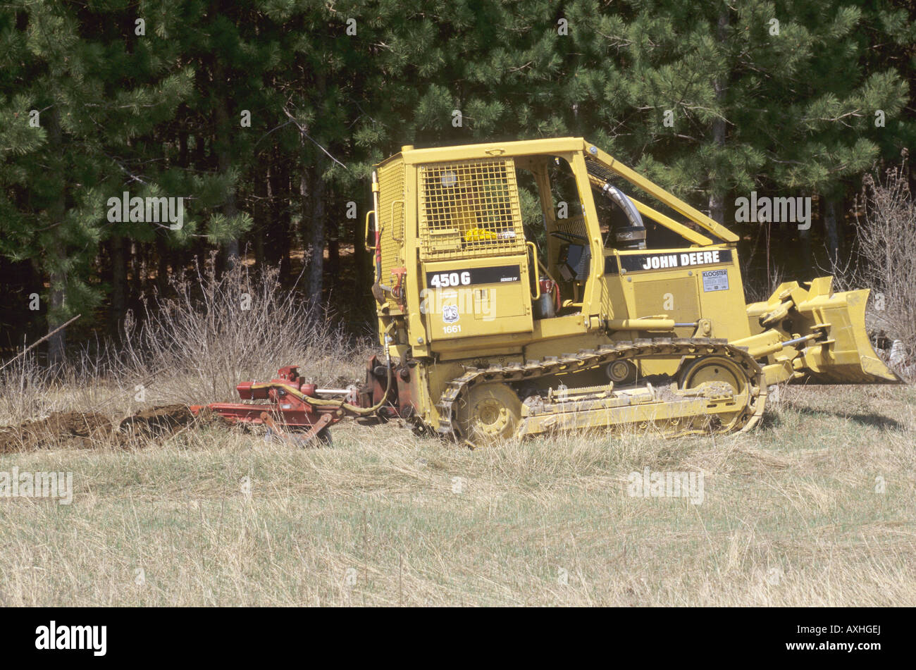 Plowing fire line around area to be burned Stock Photo - Alamy