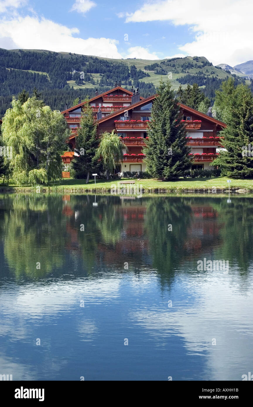 wooden cottage along a lake Stock Photo - Alamy