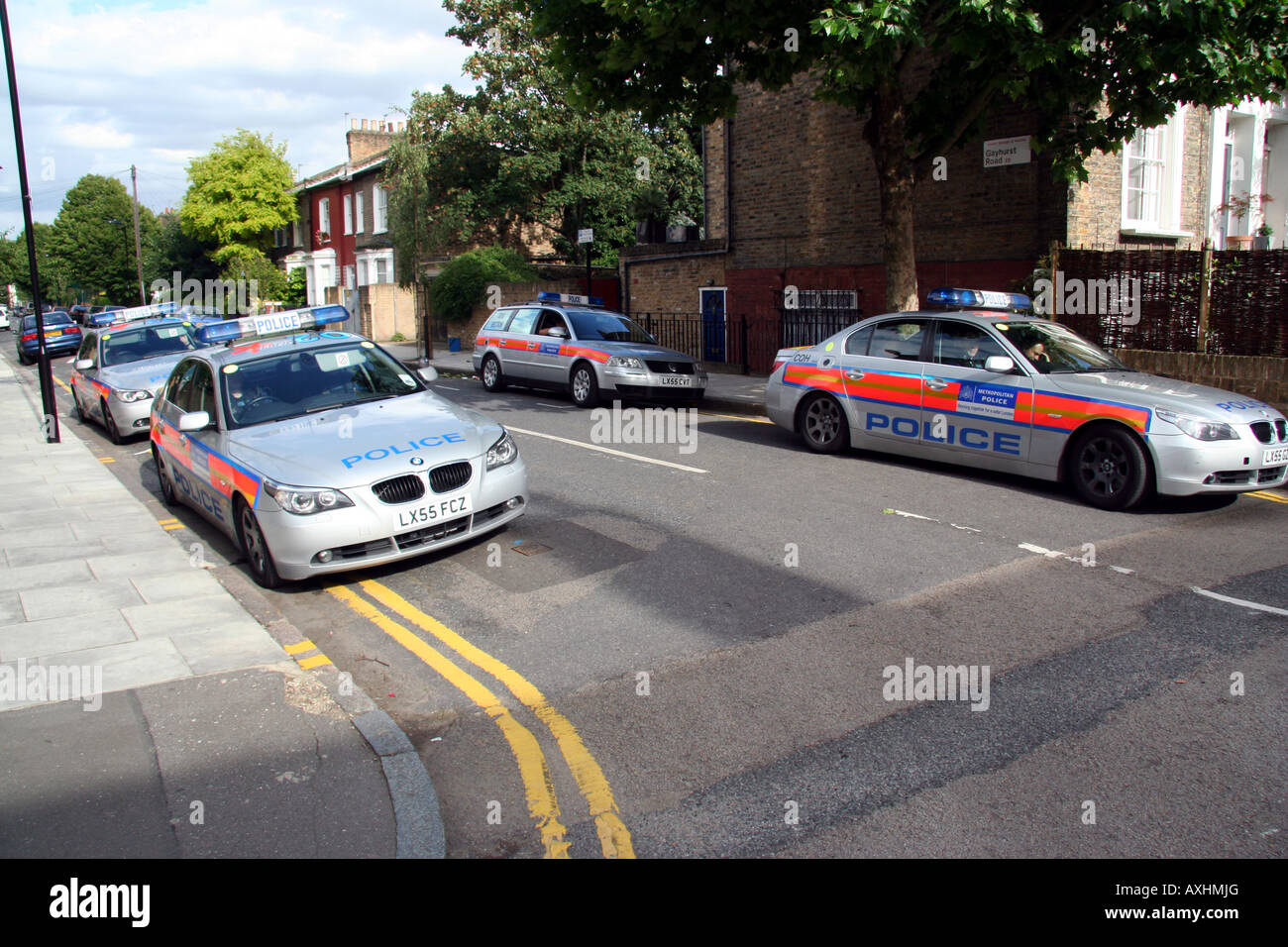 Four silver police cars on standby in a residential London street Stock ...