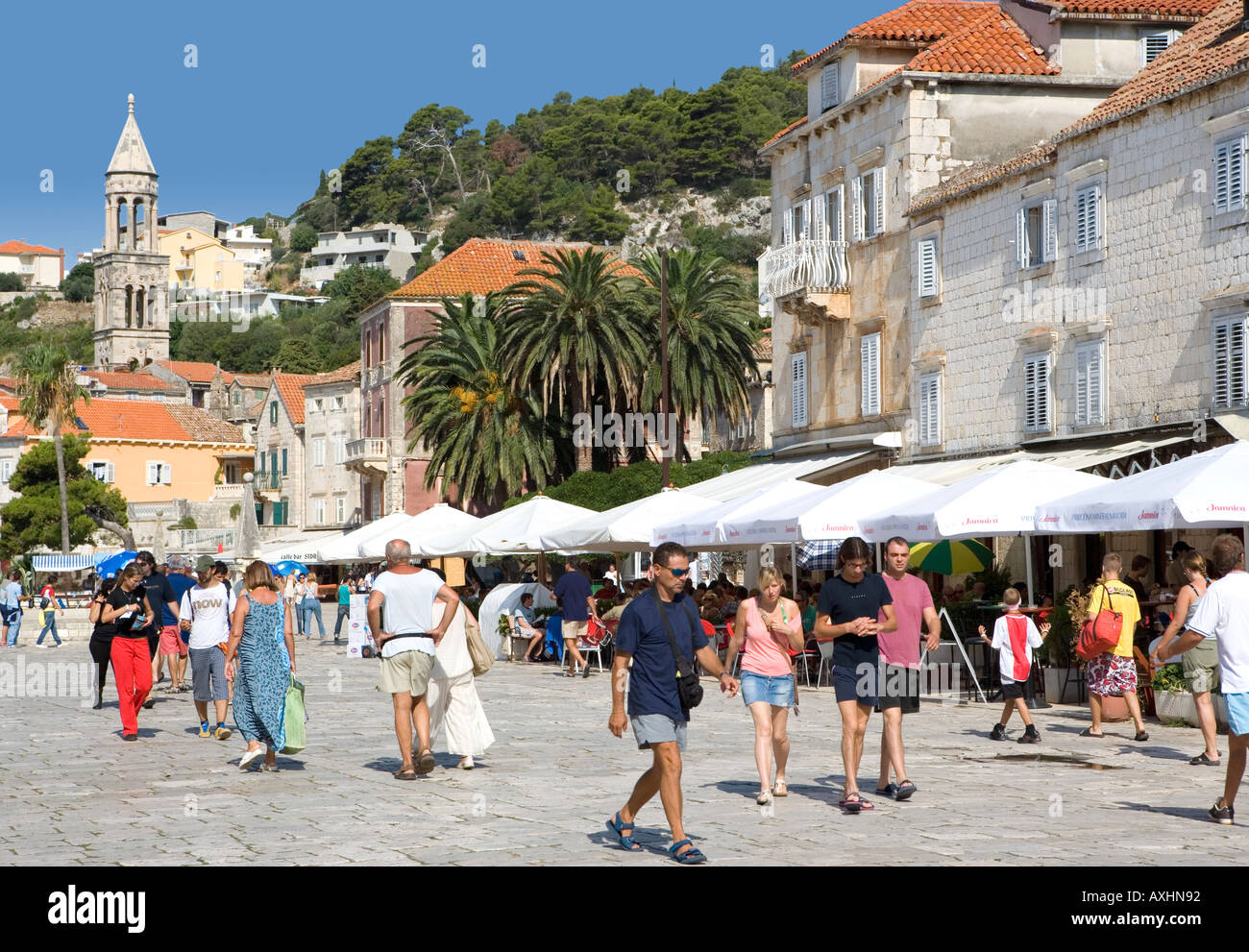Pedestrians strolling through Pjaca the main town square Hvar town Hvar ...