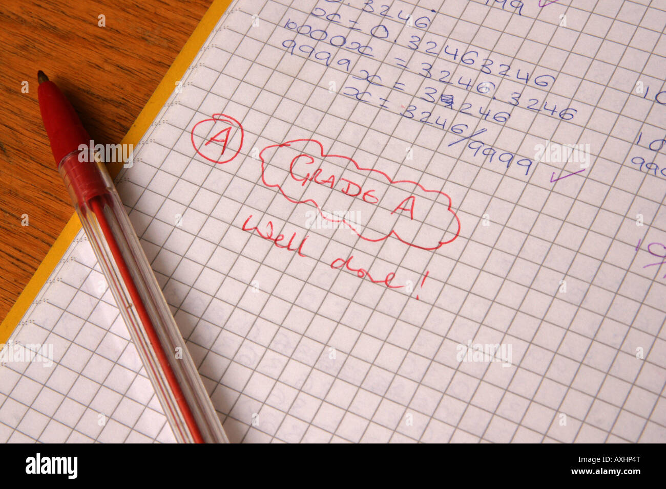 Teacher marking books hi-res stock photography and images - Alamy