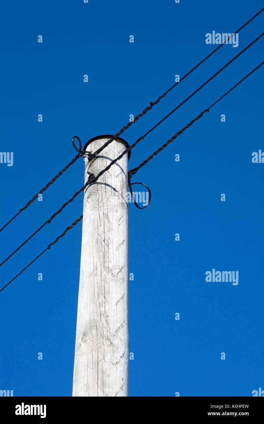 old telephone cables against blue sky Stock Photo - Alamy