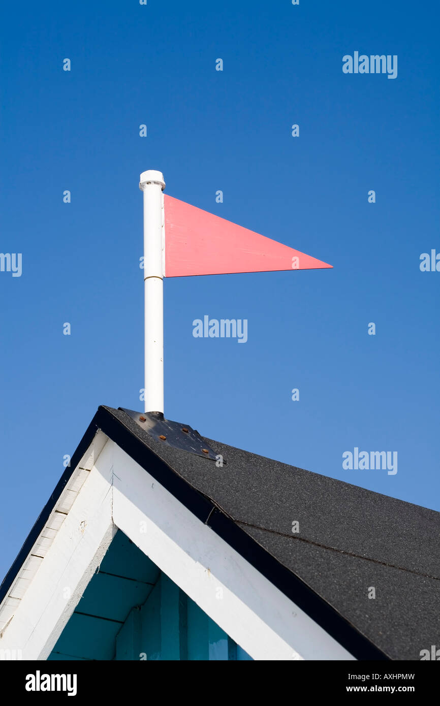 red triangular wind vane against blue sky Stock Photo - Alamy