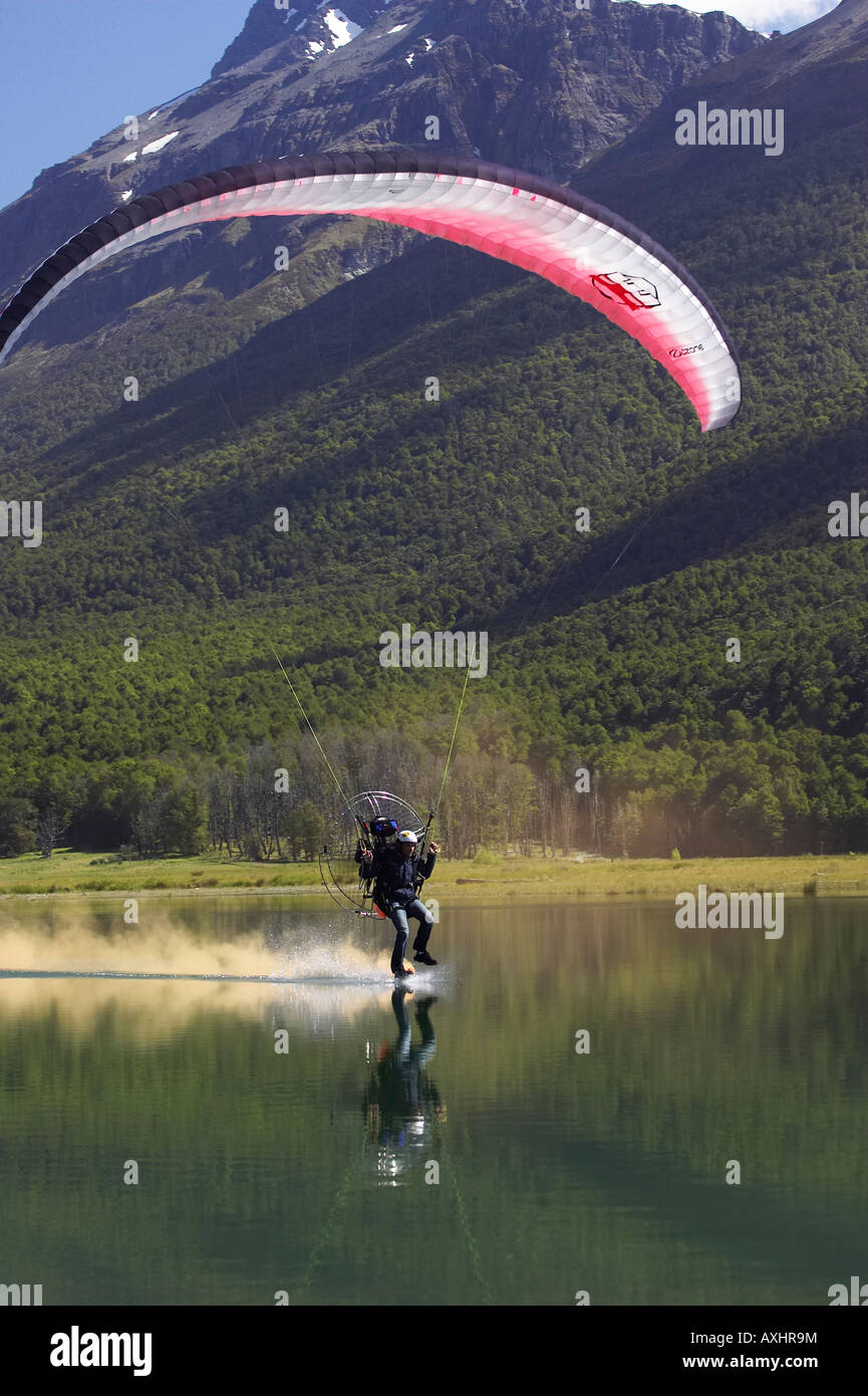 Paramotor skimming water Diamond Lake Paradise near Glenorchy ...