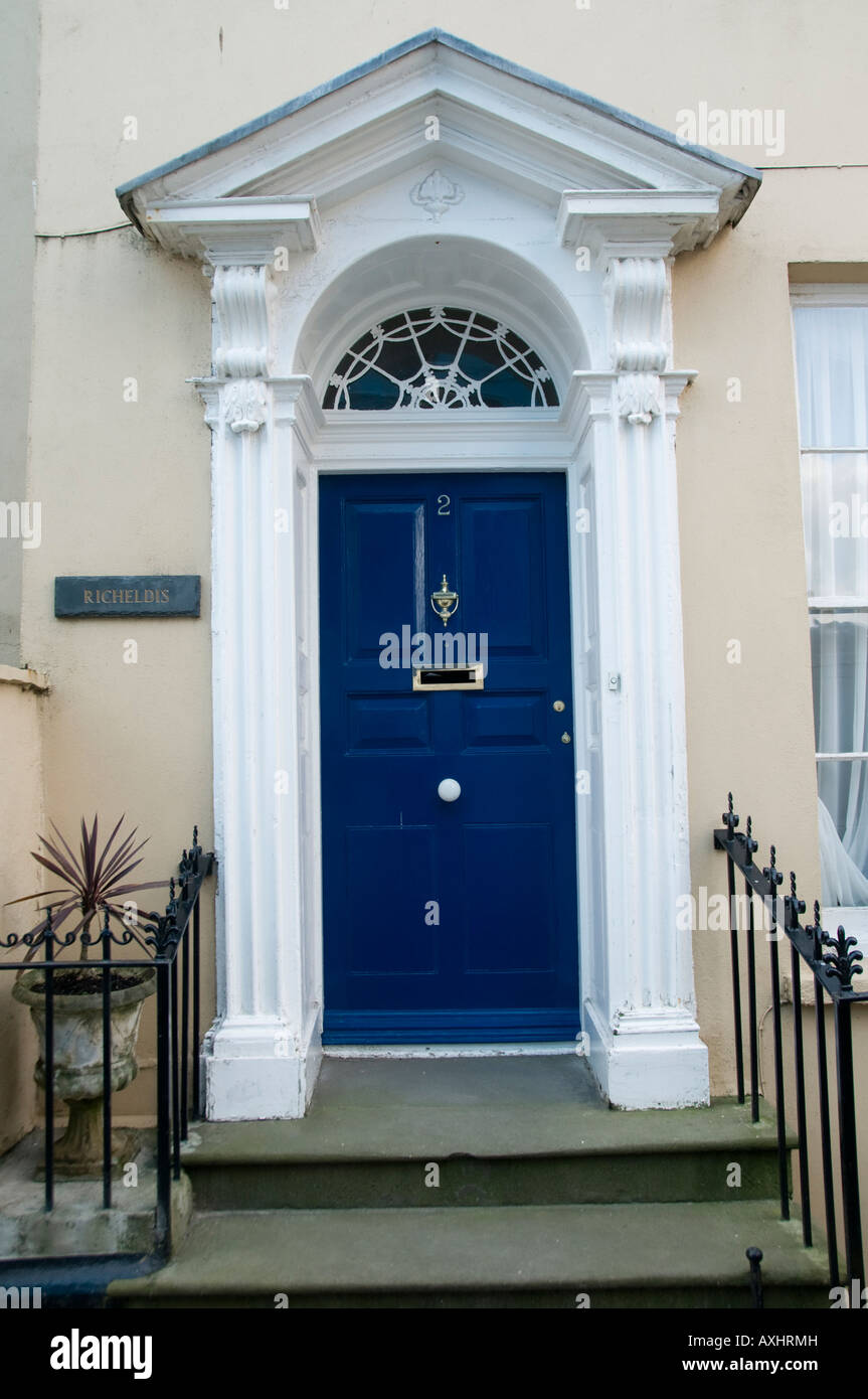 Ornate Regency era dark blue painted door in white painted door case in ...