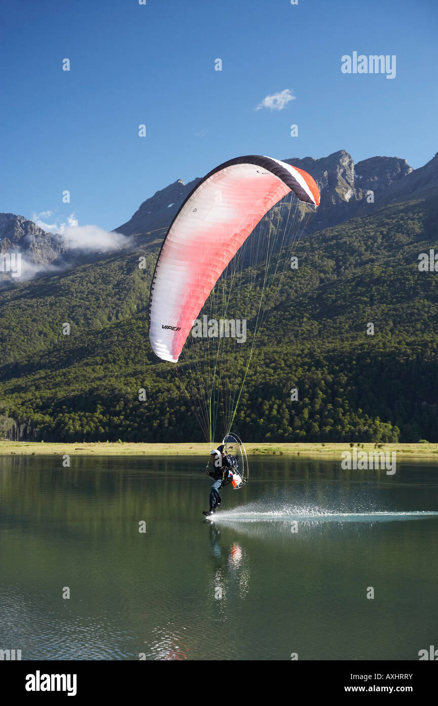 Paramotor skimming water Diamond Lake Paradise near Glenorchy ...