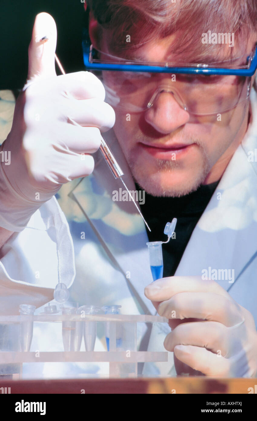 genetic engineering researcher extracting DNA from sample Stock Photo ...