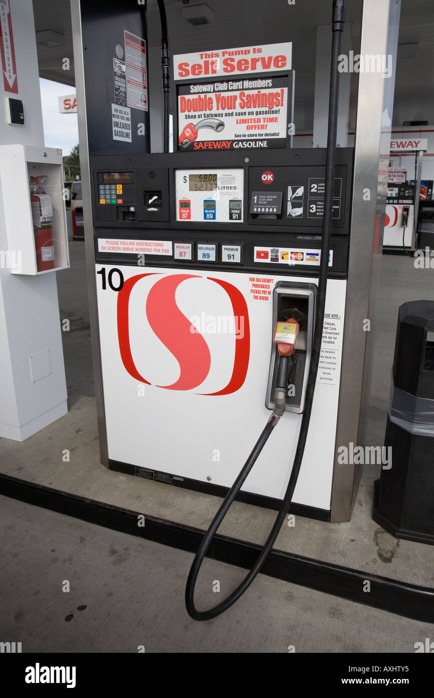 Advertising and prices on petrol pump in supermarket filling station ...