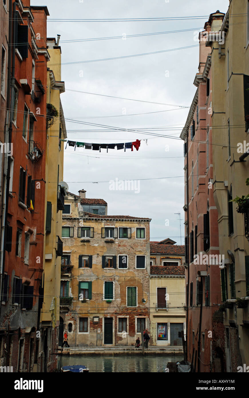 Laundry drying on lines strung between tall buildings. Venice, Italy ...