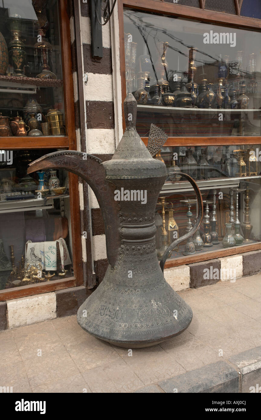 Damascus street scene and metal goods shop with very large coffee pot ...