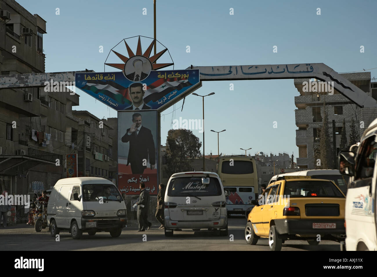 Damascus suburbs south with an arch featuring president Assad Syria ...