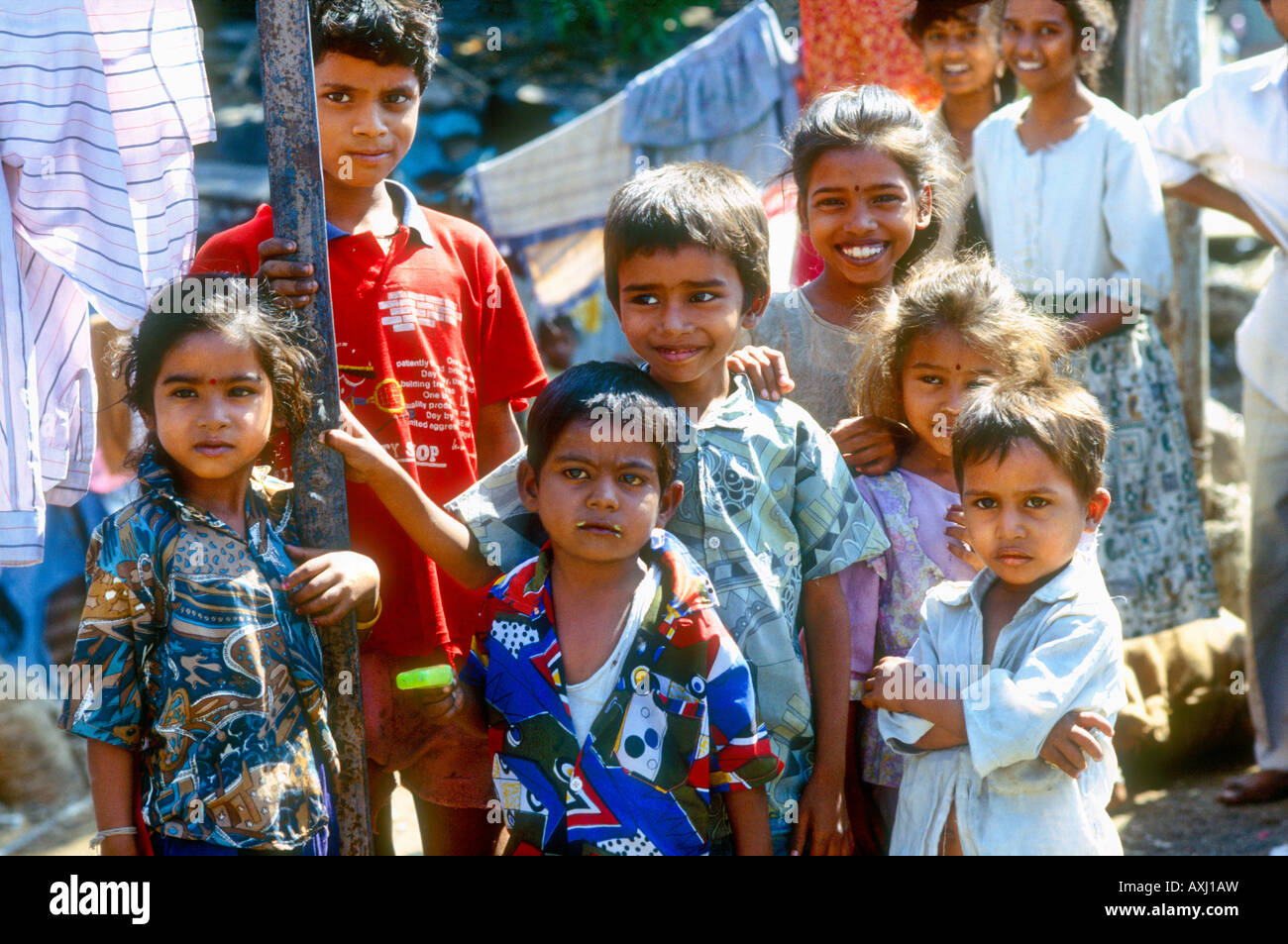 Family of poor Indian children living rough on the beaches of Mumbai ...