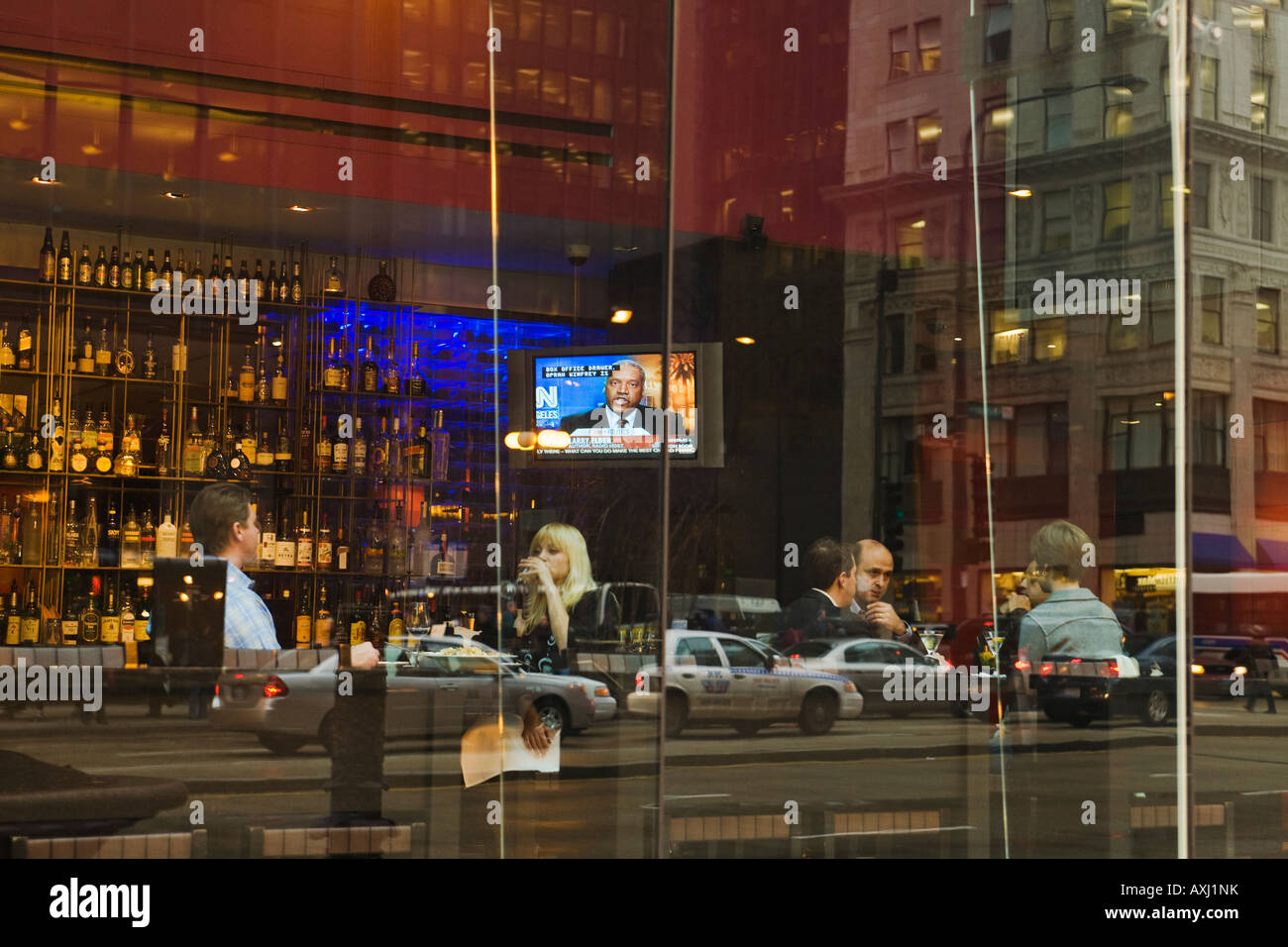 ILLINOIS Chicago Couple and men sitting in bar viewed through window ...