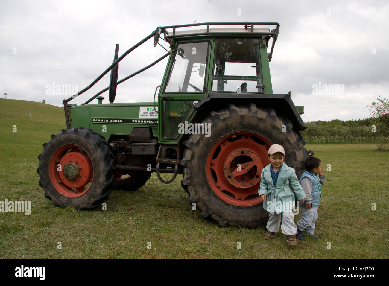 Children take a tractor driving trip Stock Photo - Alamy