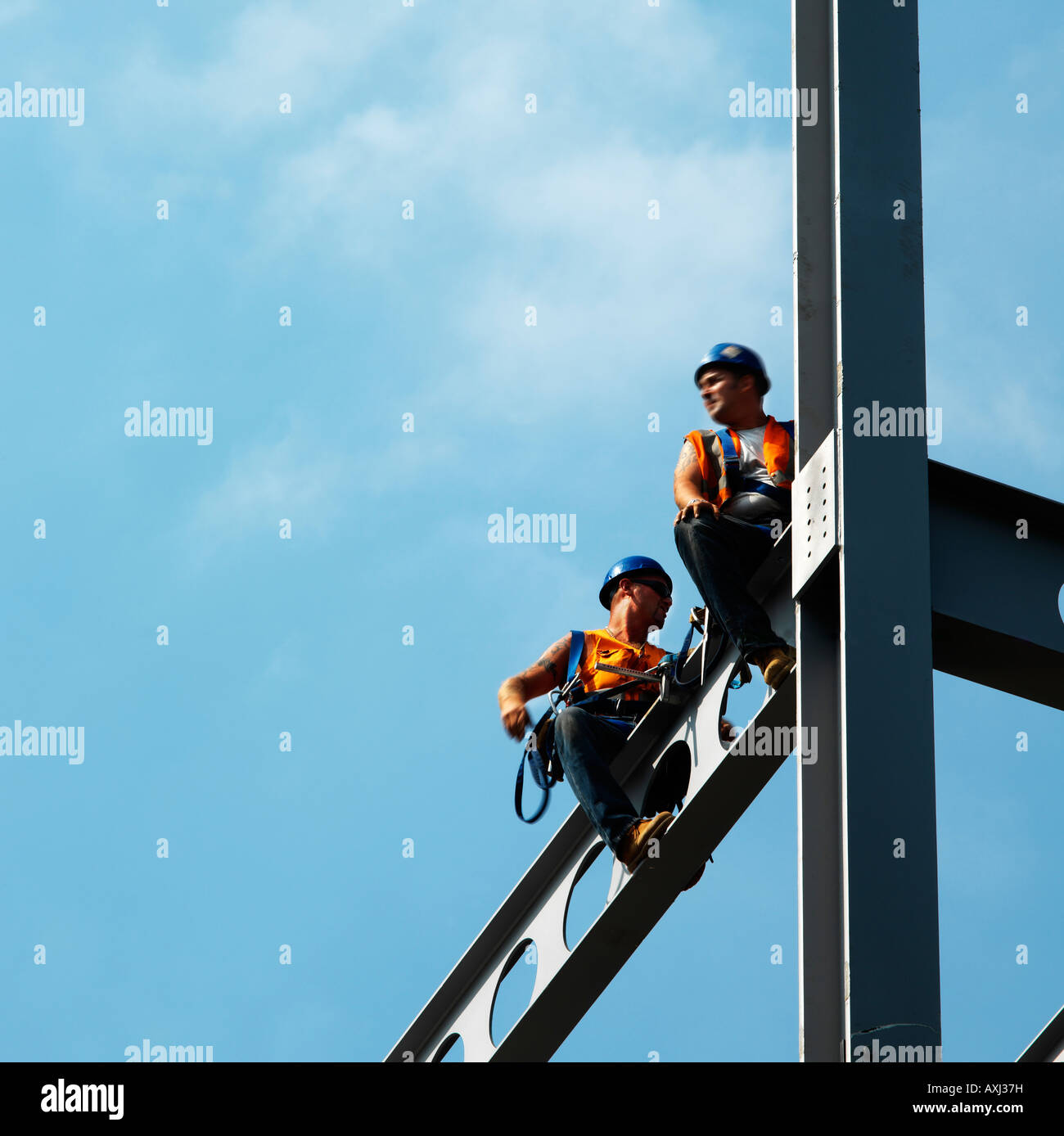 steeplejacks on girder during construction work Stock Photo - Alamy