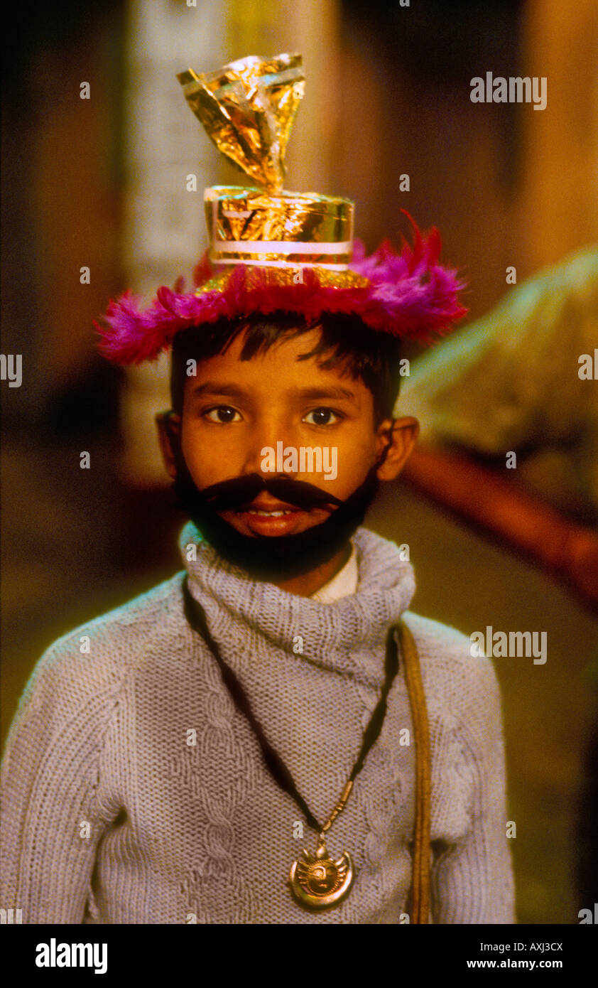 Young Indian boy in fancy dress wearing fake black beard and moustache ...
