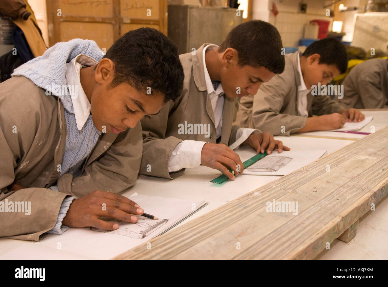 Young boy pupils engaged in ceramic workshop at the Islamic Arts and ...
