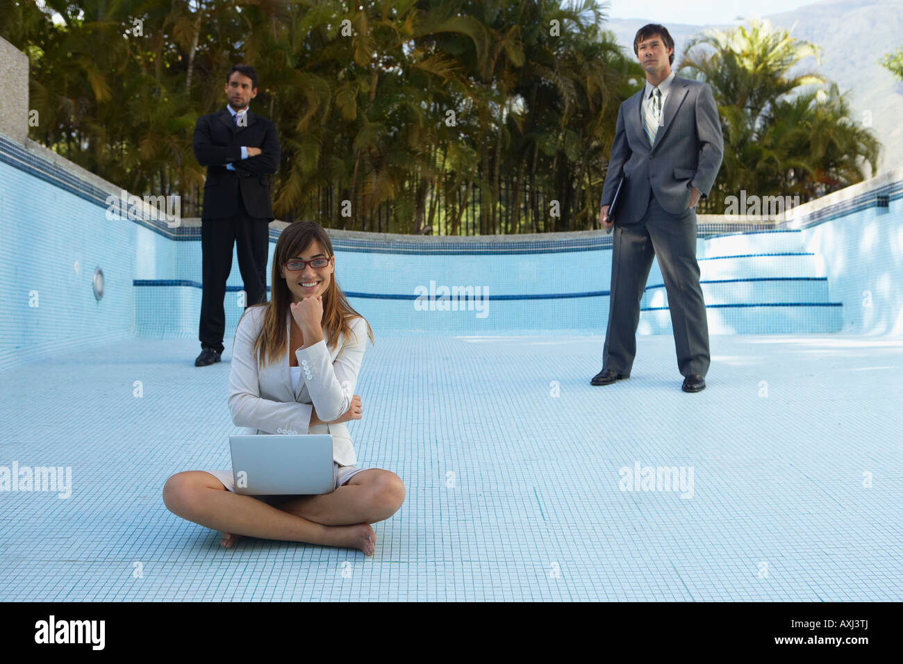 South American businesspeople in empty swimming pool Stock Photo - Alamy