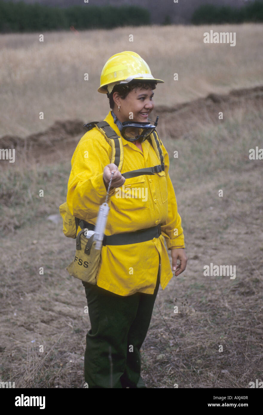 Firefighter twirls sling psychrometer to check humidity Stock Photo - Alamy