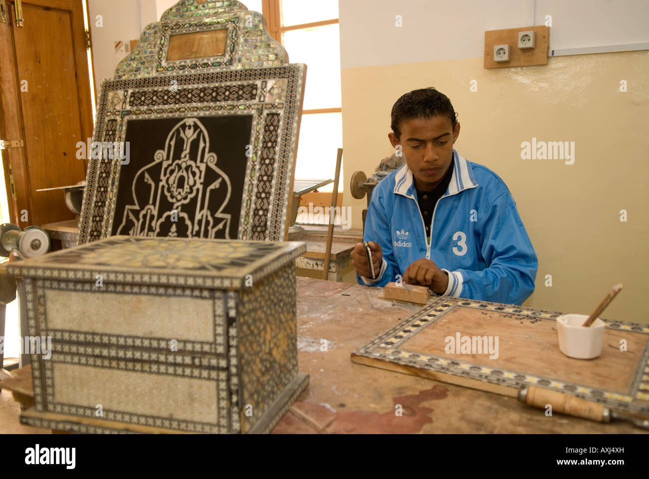Young boy pupil engaged in ceramic workshop at the Islamic Arts and ...