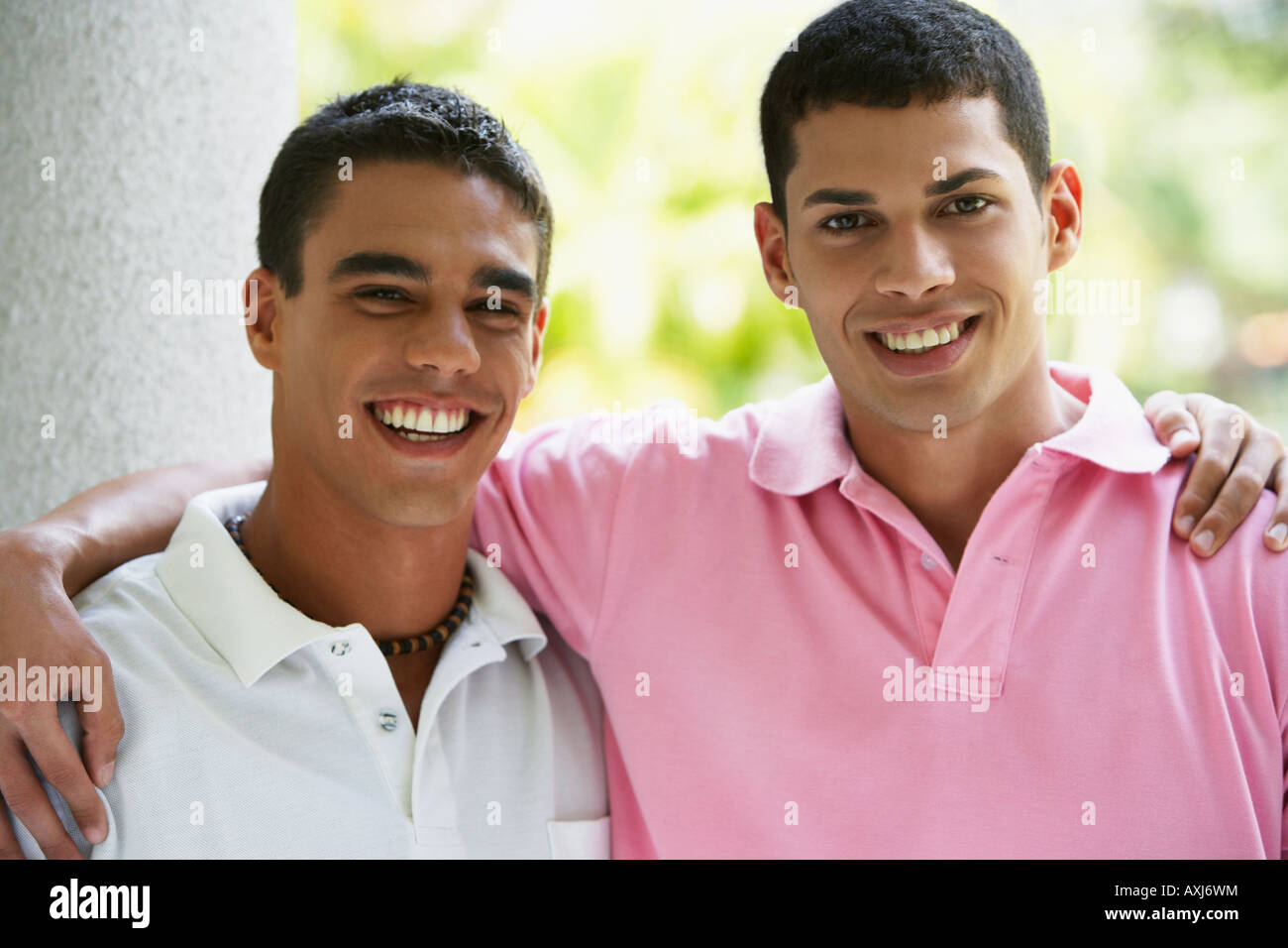 South American men hugging Stock Photo - Alamy