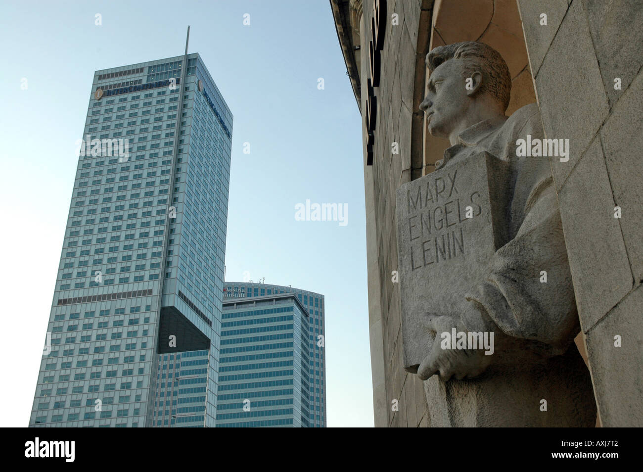 Figure of man holding Marks and Engel book on Palace of Culture and ...