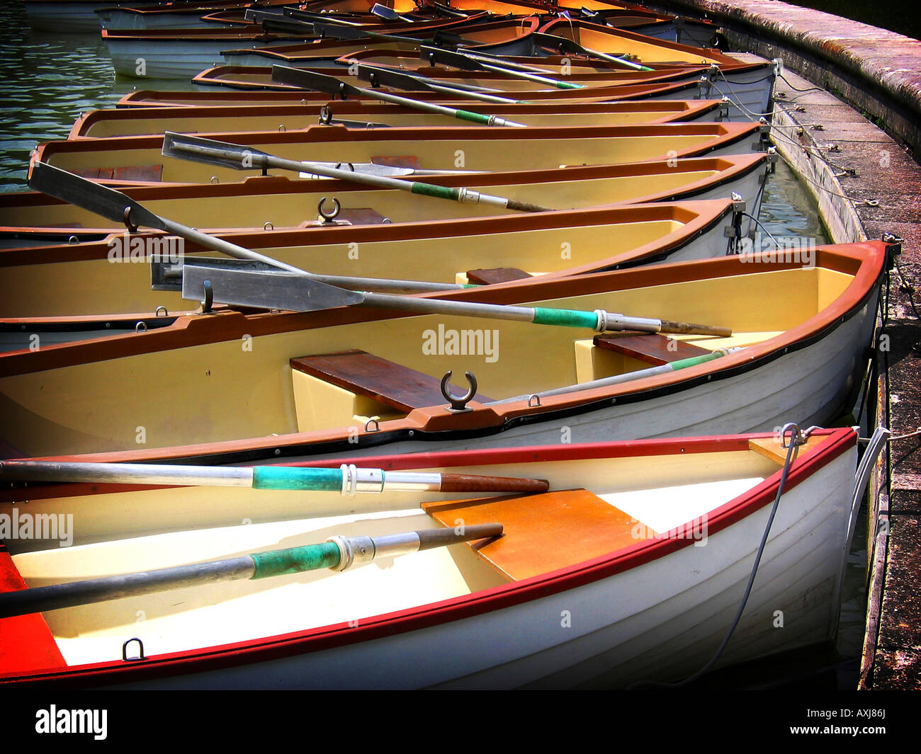 Rowboats in a line on lake at Palace of Versailles, France Stock Photo ...