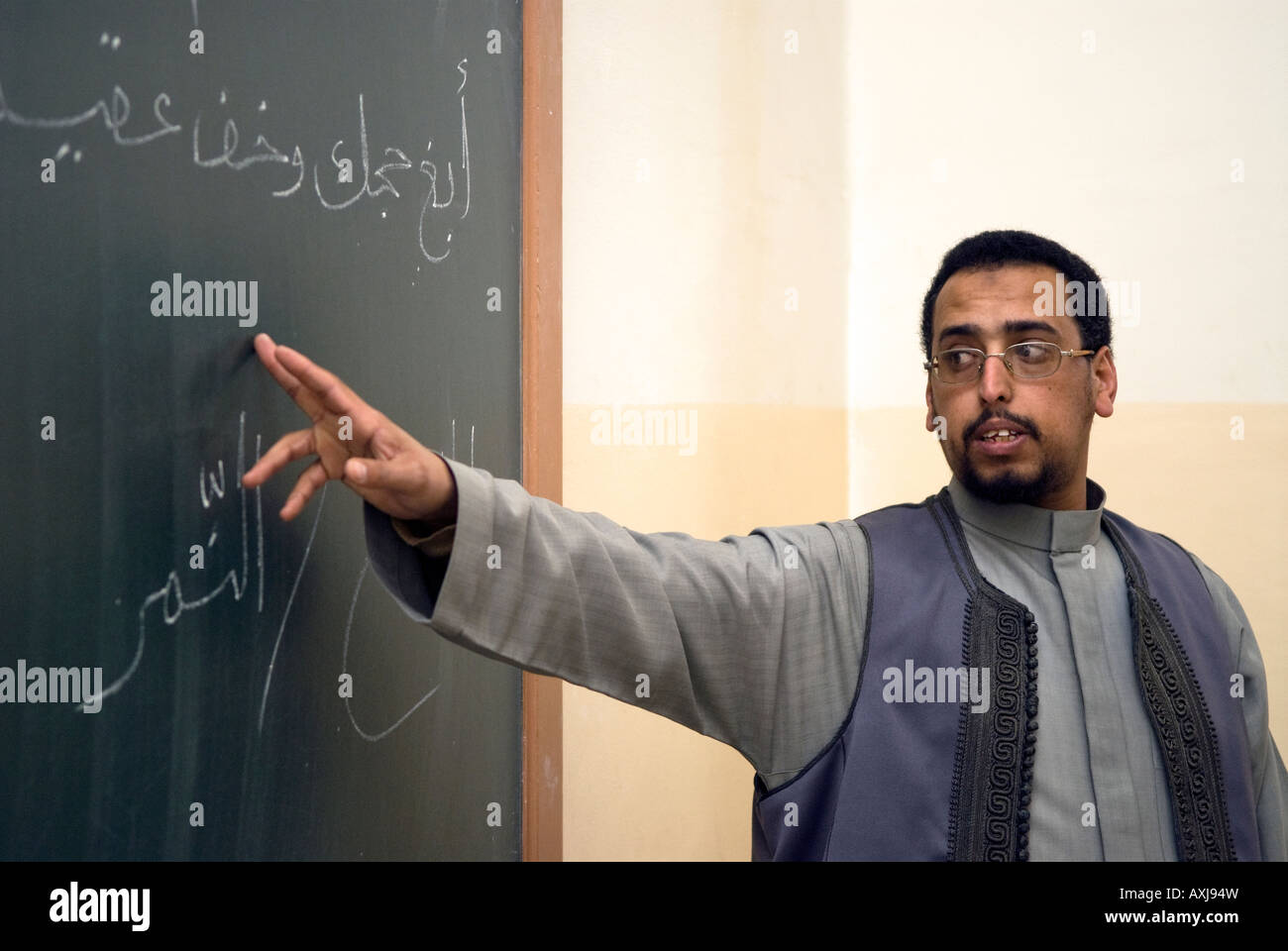 Teacher instructing Arabic at the Islamic Arts and Crafts School ...