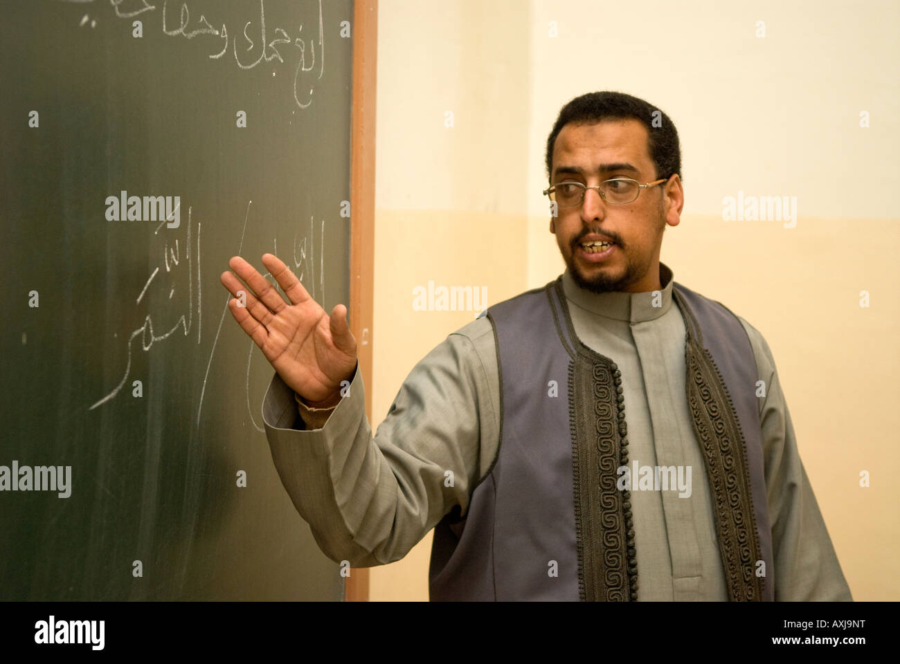 Teacher instructing Arabic at the Islamic Arts and Crafts School ...