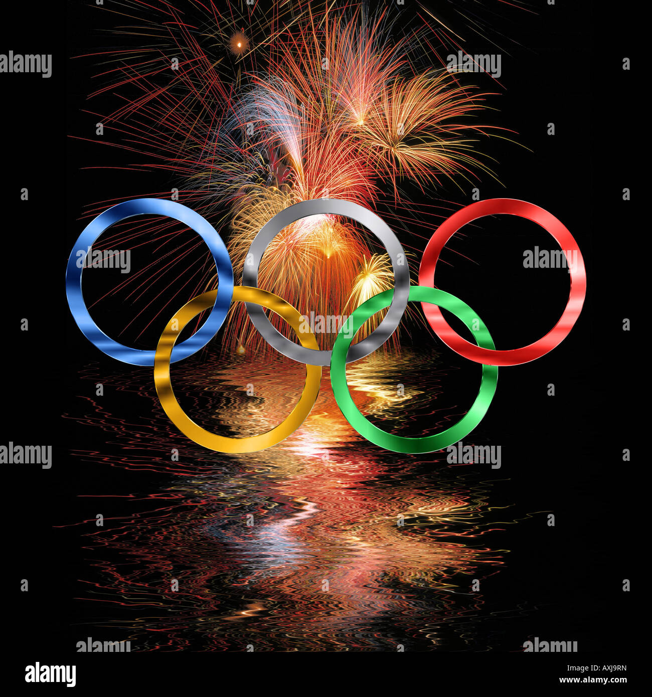 Metallic olympic rings against a backdrop of fireworks in deep black ...