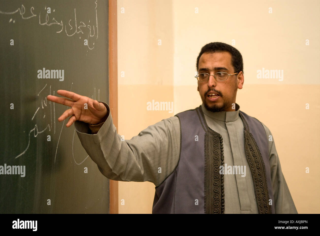 Teacher instructing Arabic at the Islamic Arts and Crafts School ...