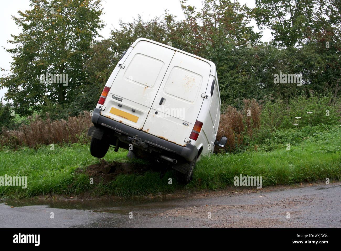 A white van crashed into a ditch Stock Photo: 9632707 - Alamy