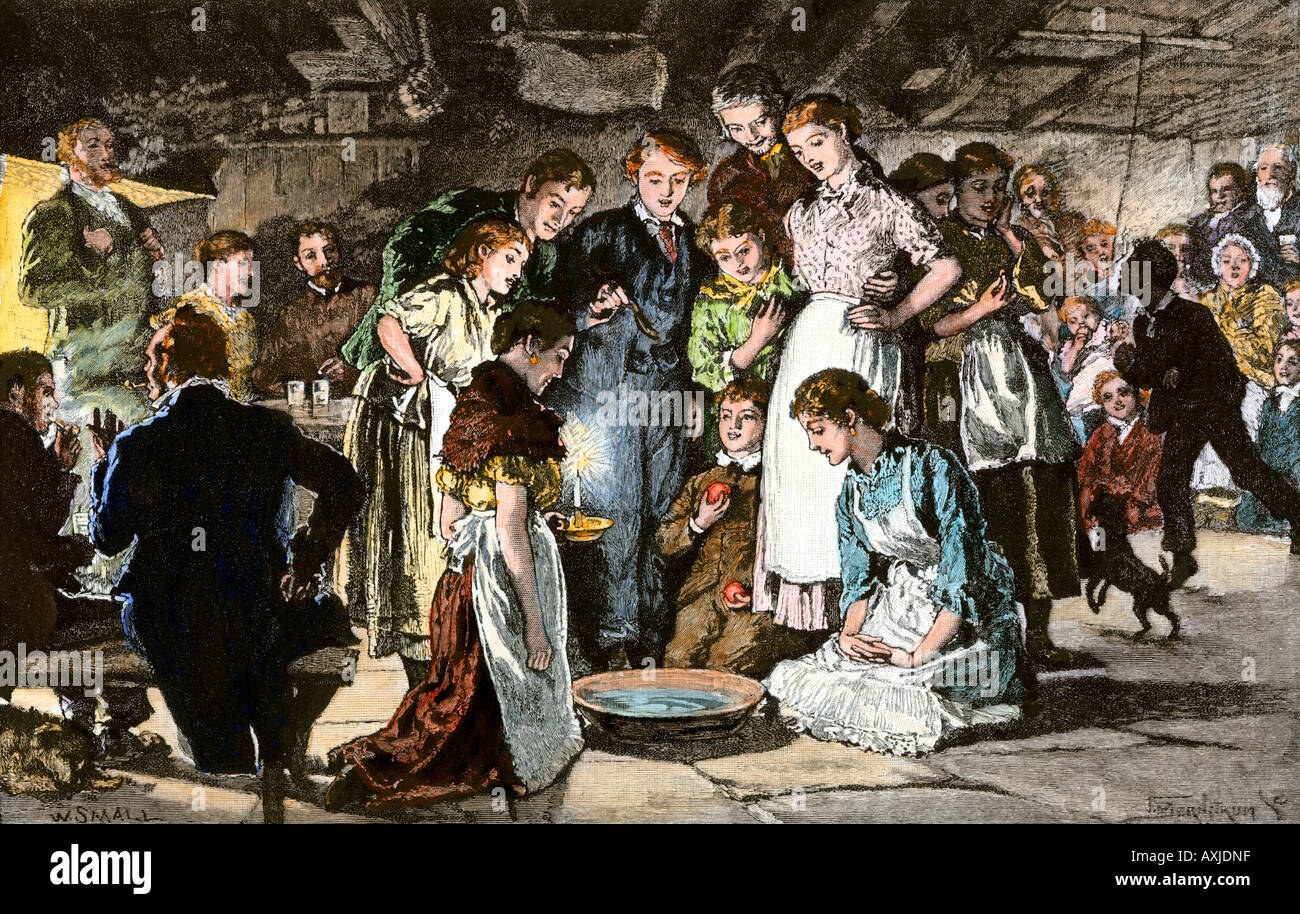 Bobbing for apples at a Halloween party in Ireland 1800s. Hand-colored ...