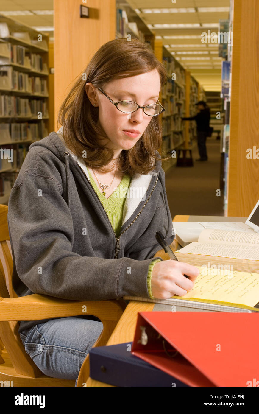 Woman studying in a quiet library hi-res stock photography and images ...