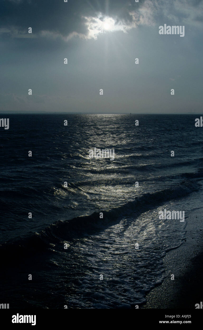 Waves ripple along a beach Stock Photo - Alamy