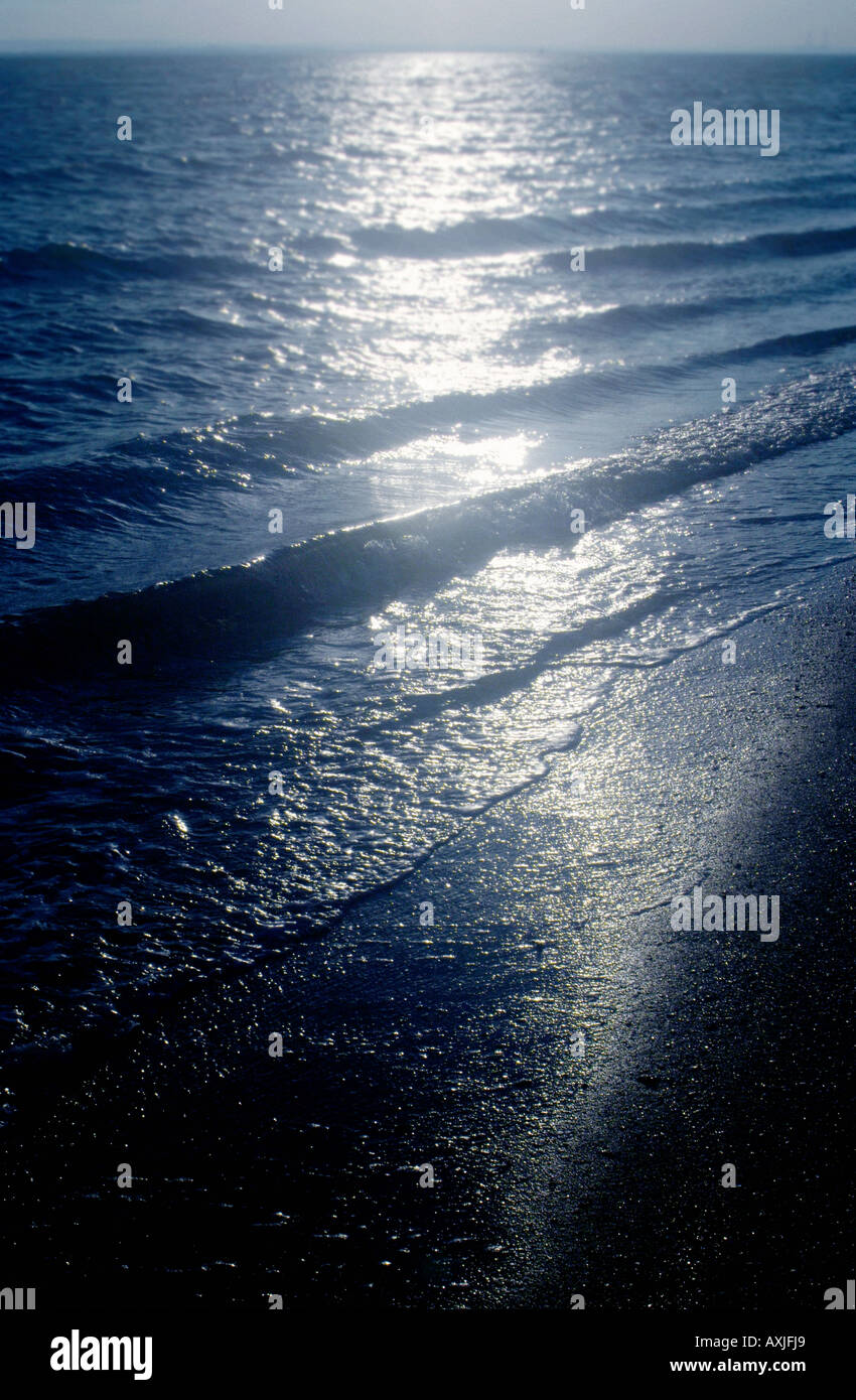Waves ripple along a beach Stock Photo - Alamy