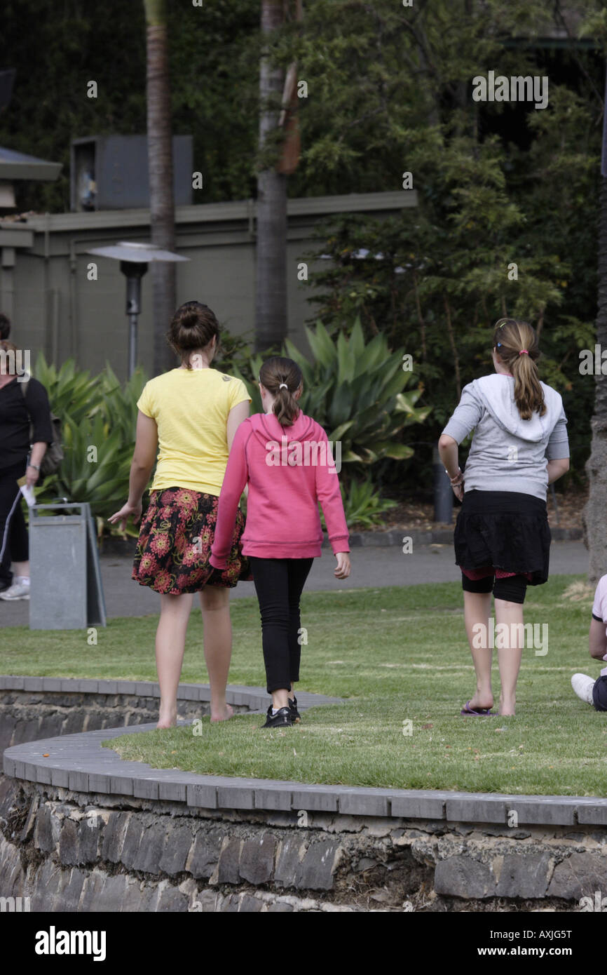 three girls walking in the park in summer afternoon Stock Photo - Alamy