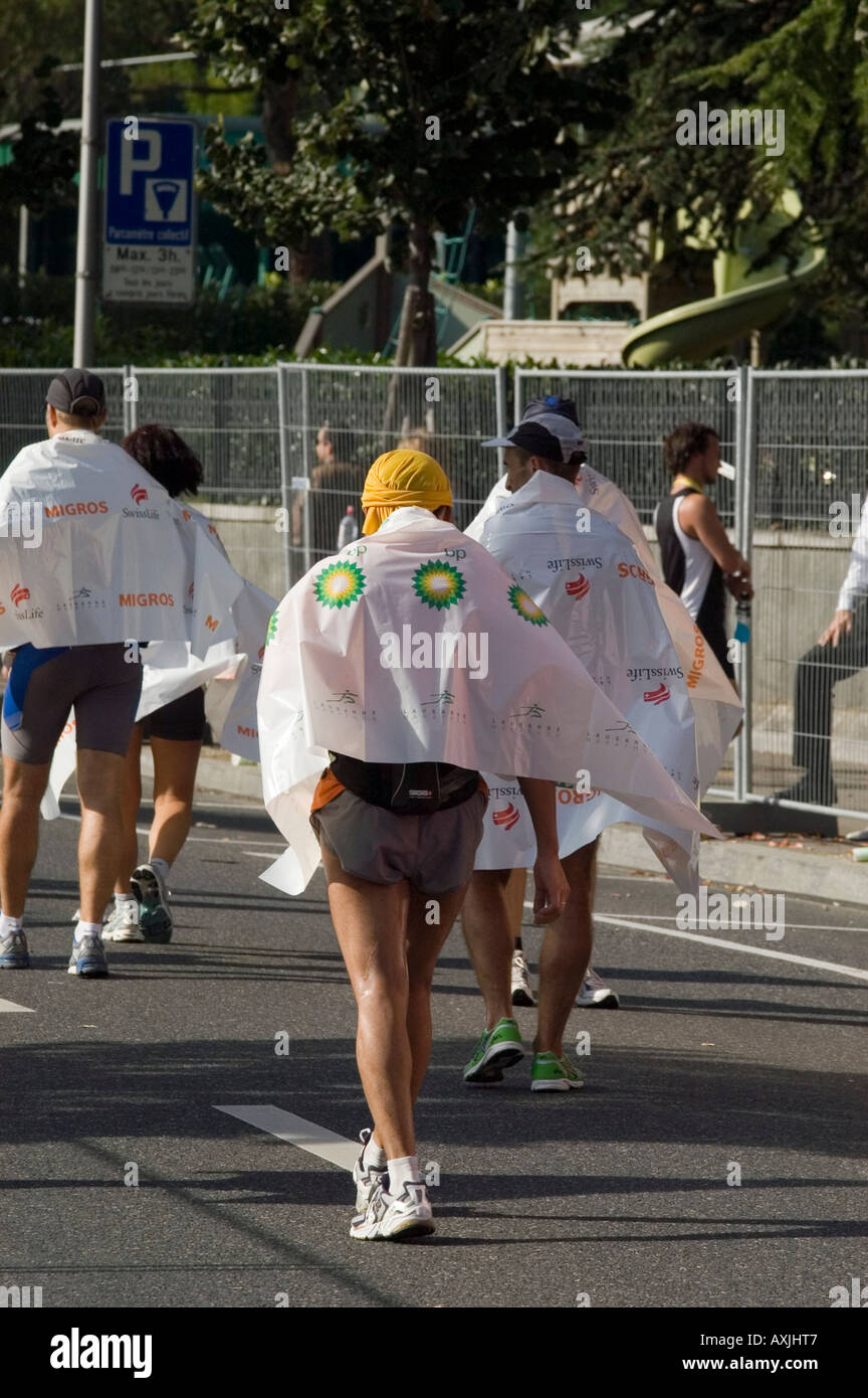 Volunteers ensure that finishing runners are looked after at the end of ...
