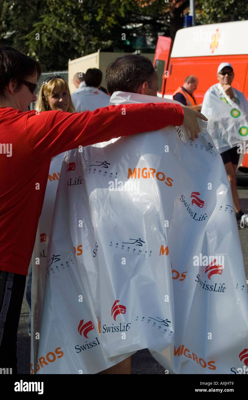 Volunteers ensure that finishing runners are looked after at the end of ...