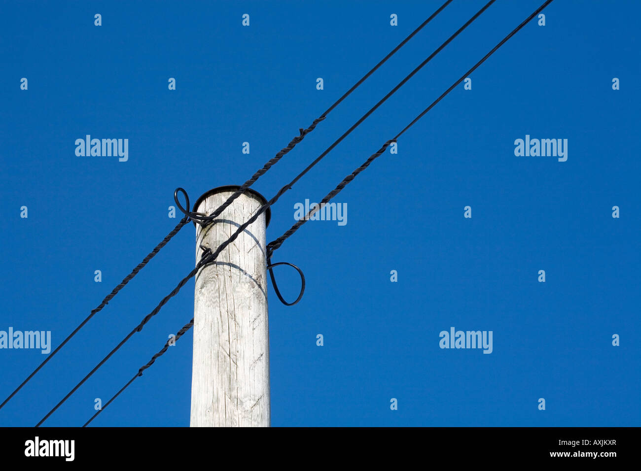 old telephone cables against blue sky Stock Photo - Alamy
