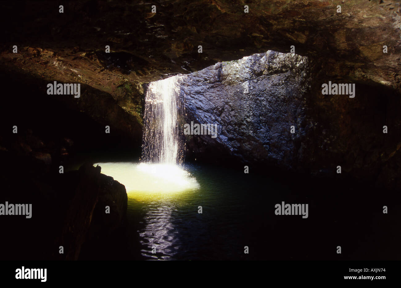 Natural arch waterfall cascade cave sunlight numinbah valley queensland australia hi-res stock ...