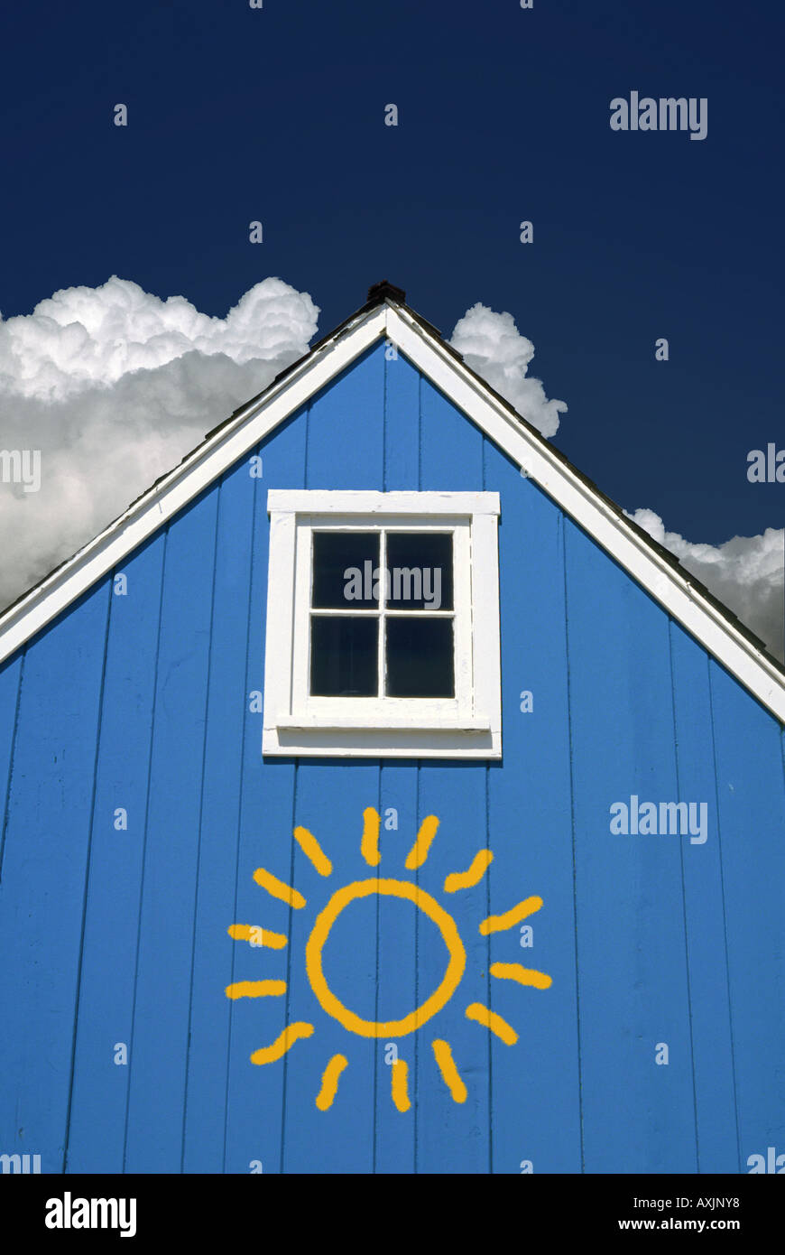 Little blue house gable with white square little window and a little ...