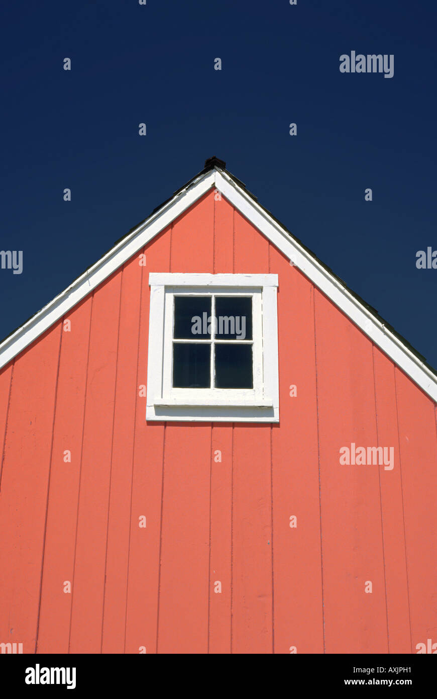 Little pinkish house gable with white square little window Stock Photo ...