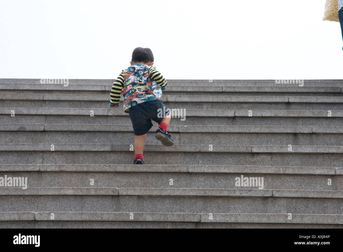 A boy walk on stairs Stock Photo - Alamy