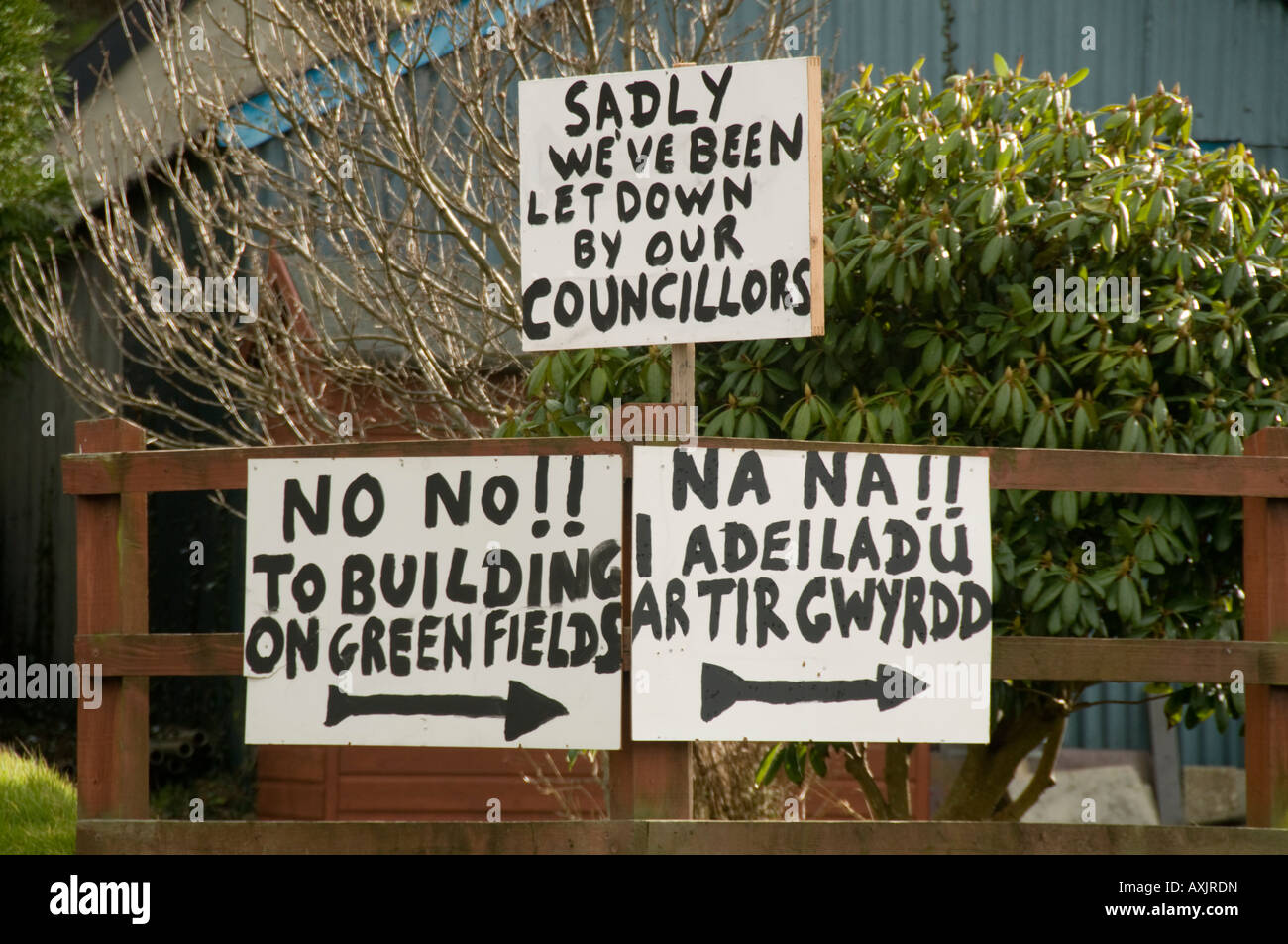 Handwritten signs put up by local residents opposing new housing ...