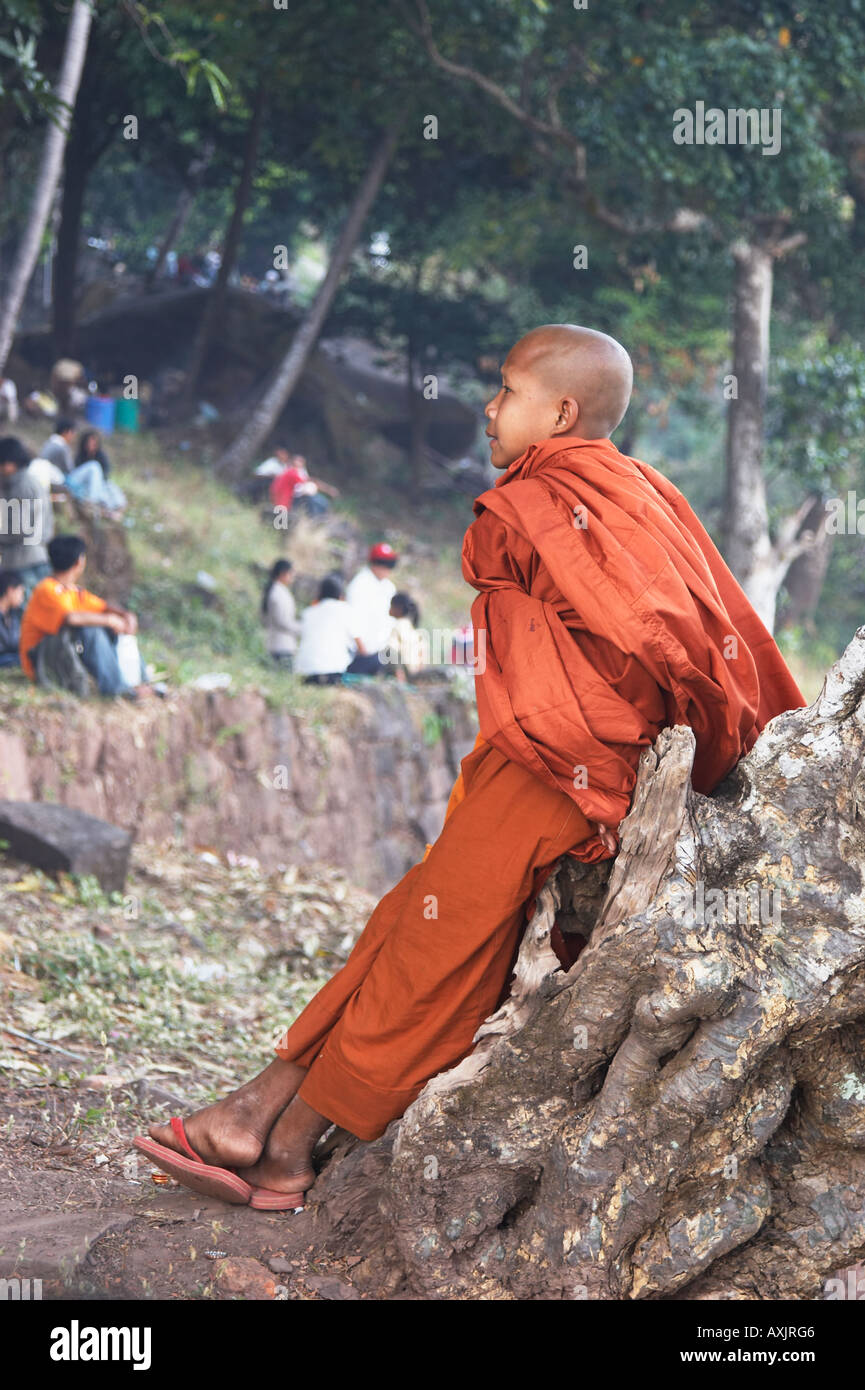 Monk Leaning Against Tree , Wat Phu Stock Photo - Alamy