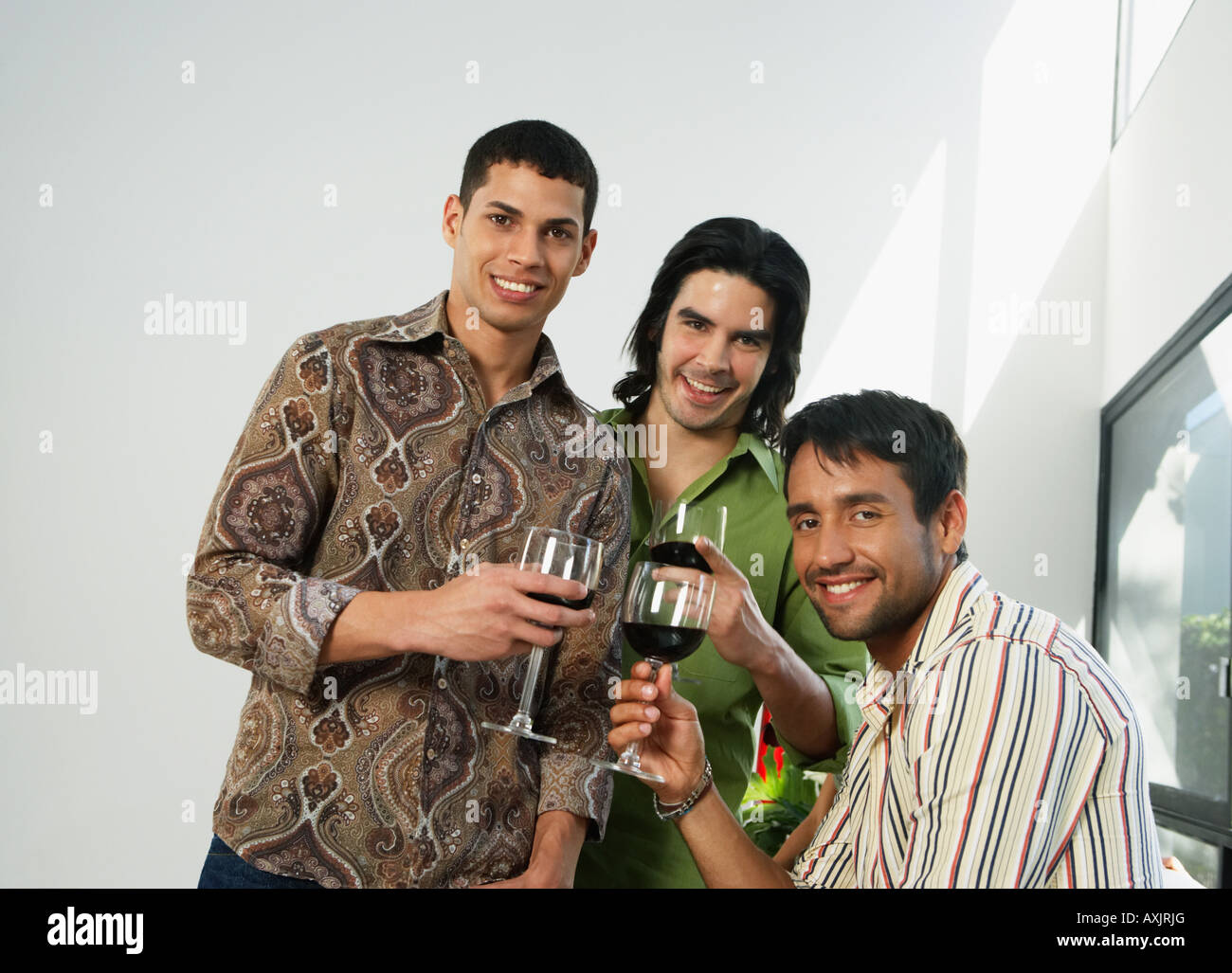 South American men drinking wine Stock Photo - Alamy