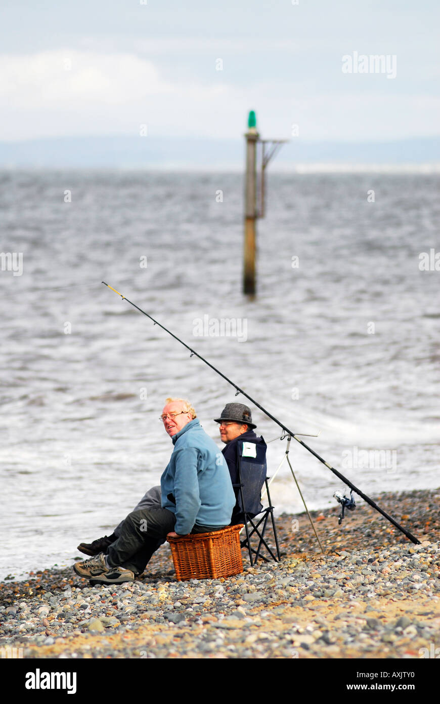 Fishing off the beach Stock Photo - Alamy