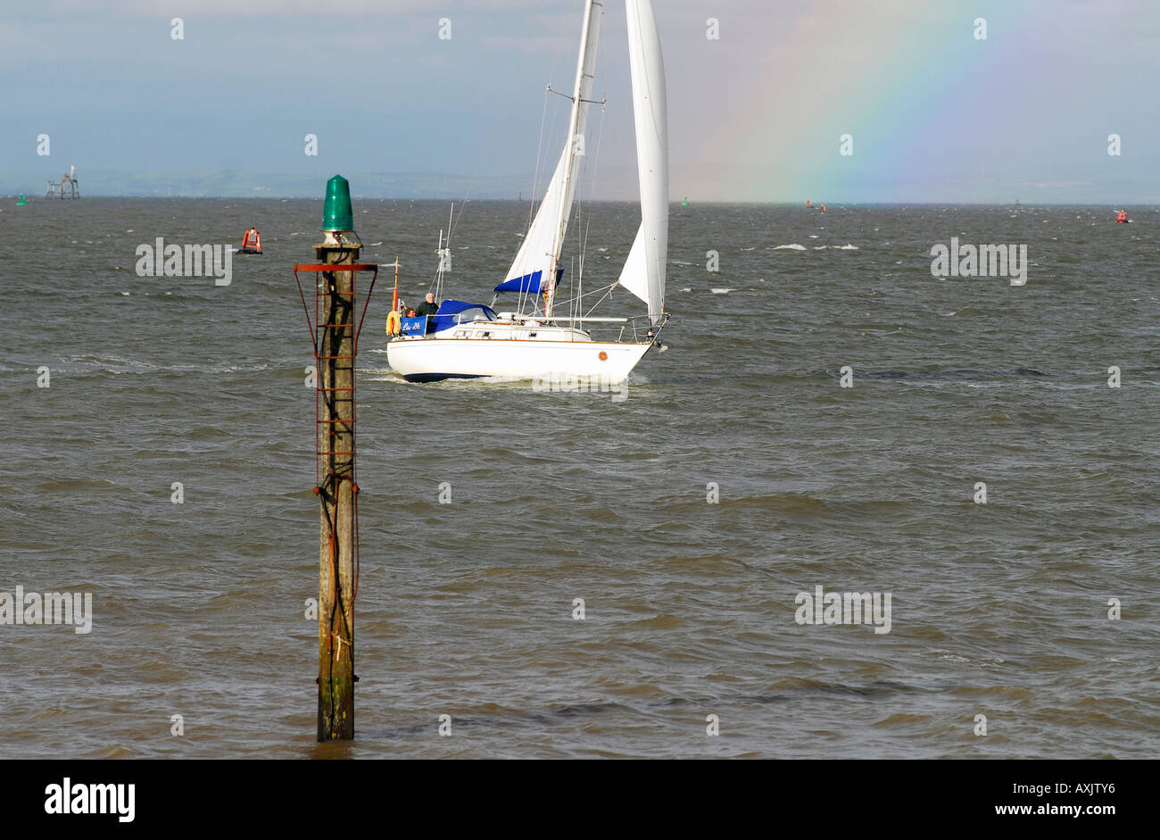 Yacht sailing up channel into Fleetwood Stock Photo - Alamy