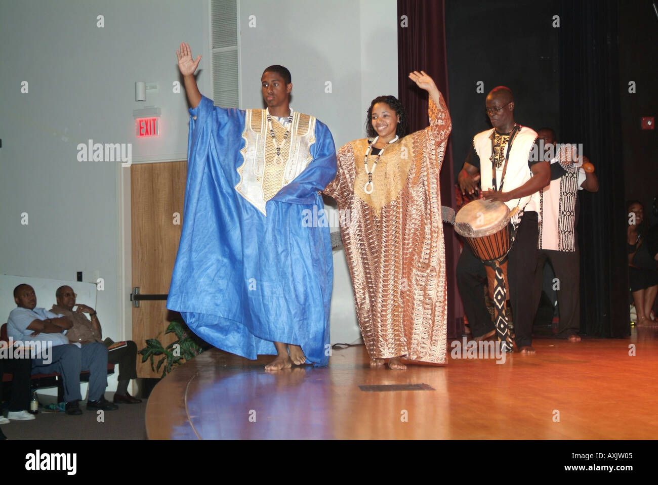teens playing African kng and queen on stage in the African dance ...